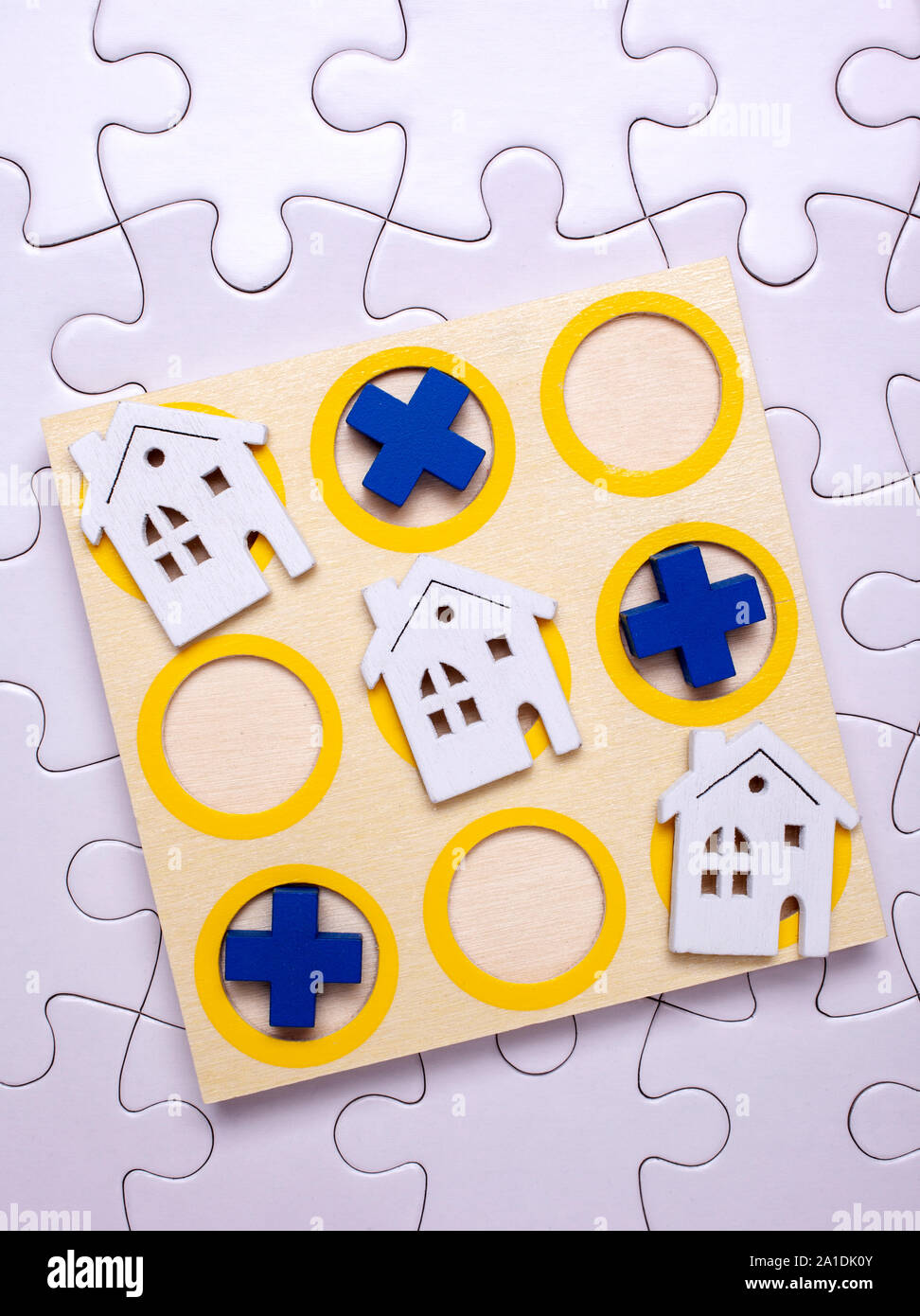 tic tac toe using house shape on puzzle background- real estate ...