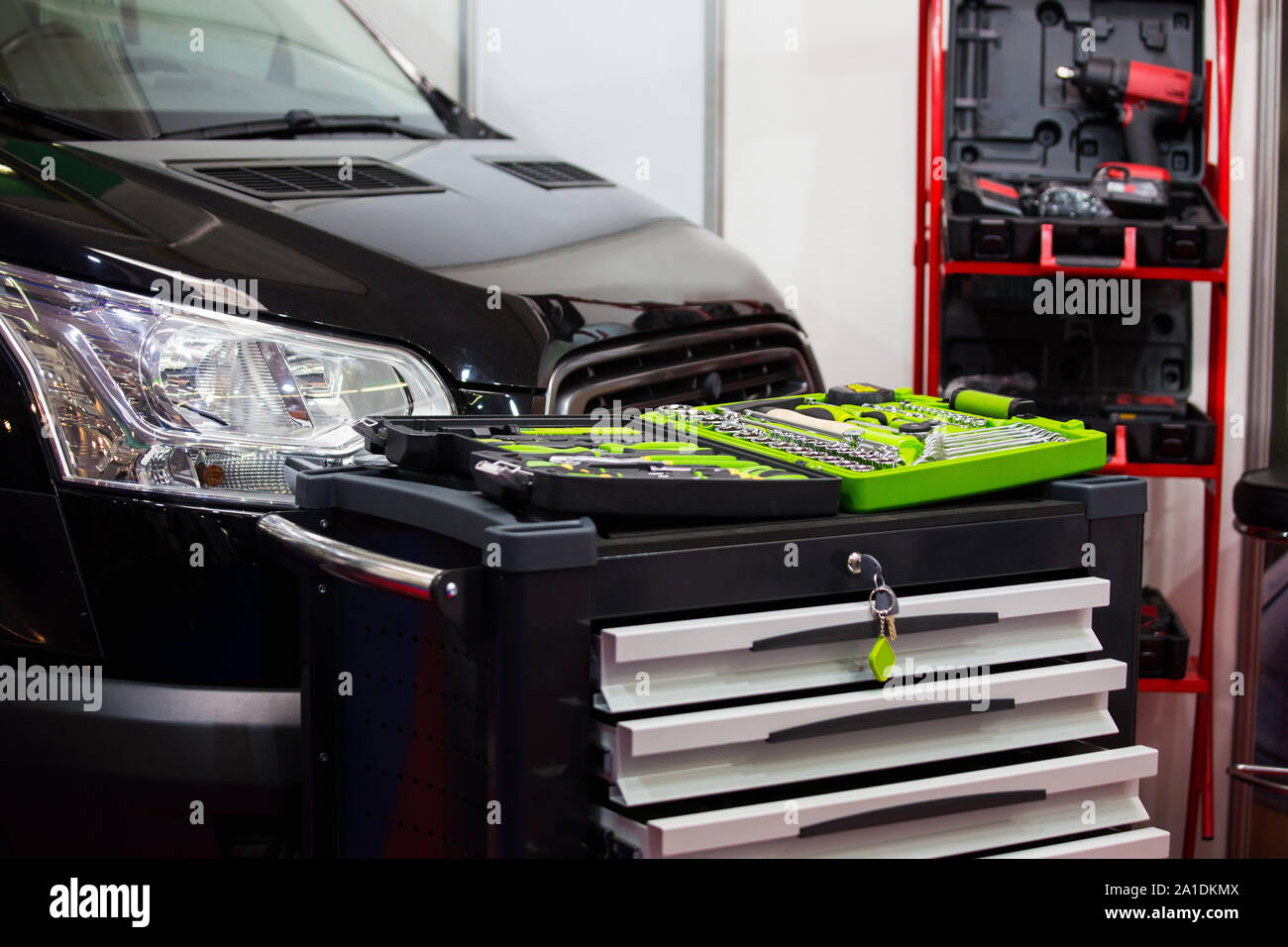 Car service. Tools box next to the minivan Stock Photo - Alamy