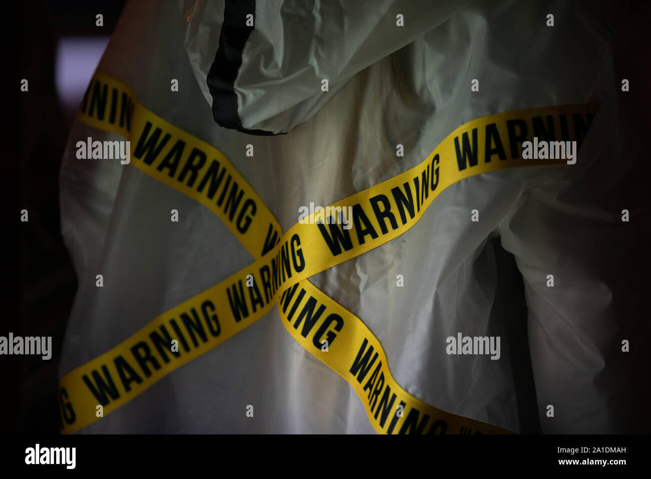 yellow ribbon with the inscription warning at the raincoat. radiation ...