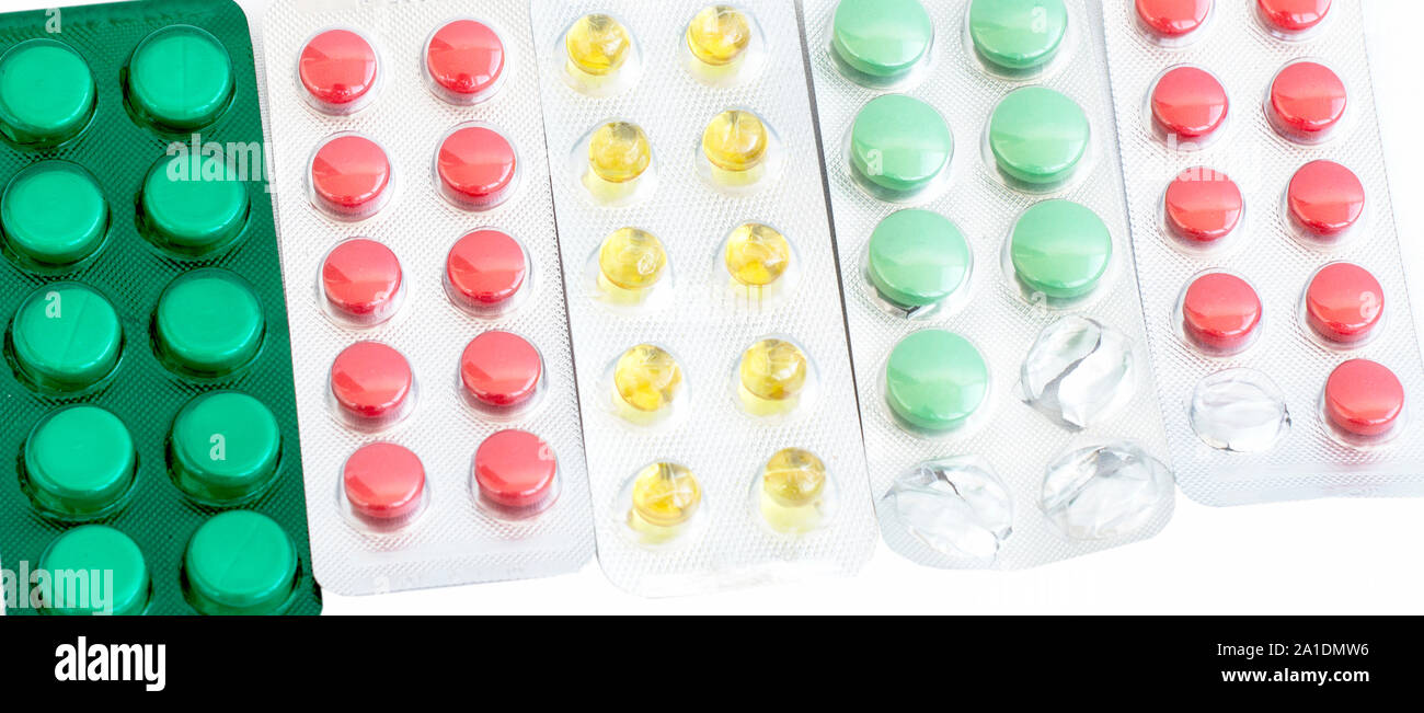 Different tablets of different colors on a white background Stock Photo ...
