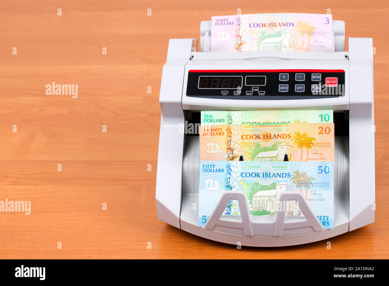 Money from Cook Islands in a counting machine Stock Photo - Alamy