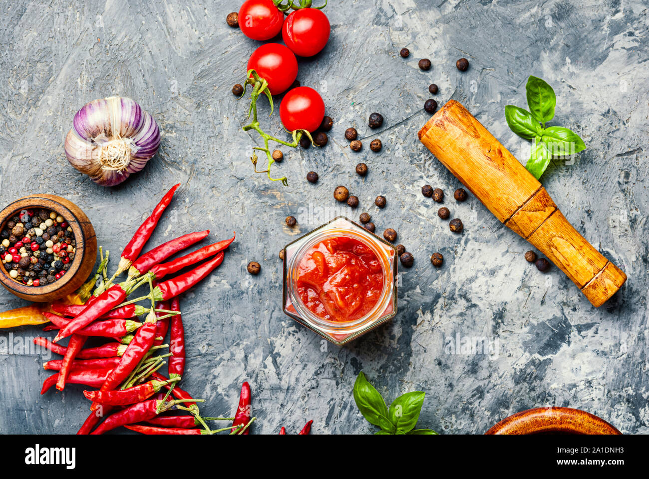 Spicy hot chili sauce with of chilli pepper Stock Photo - Alamy