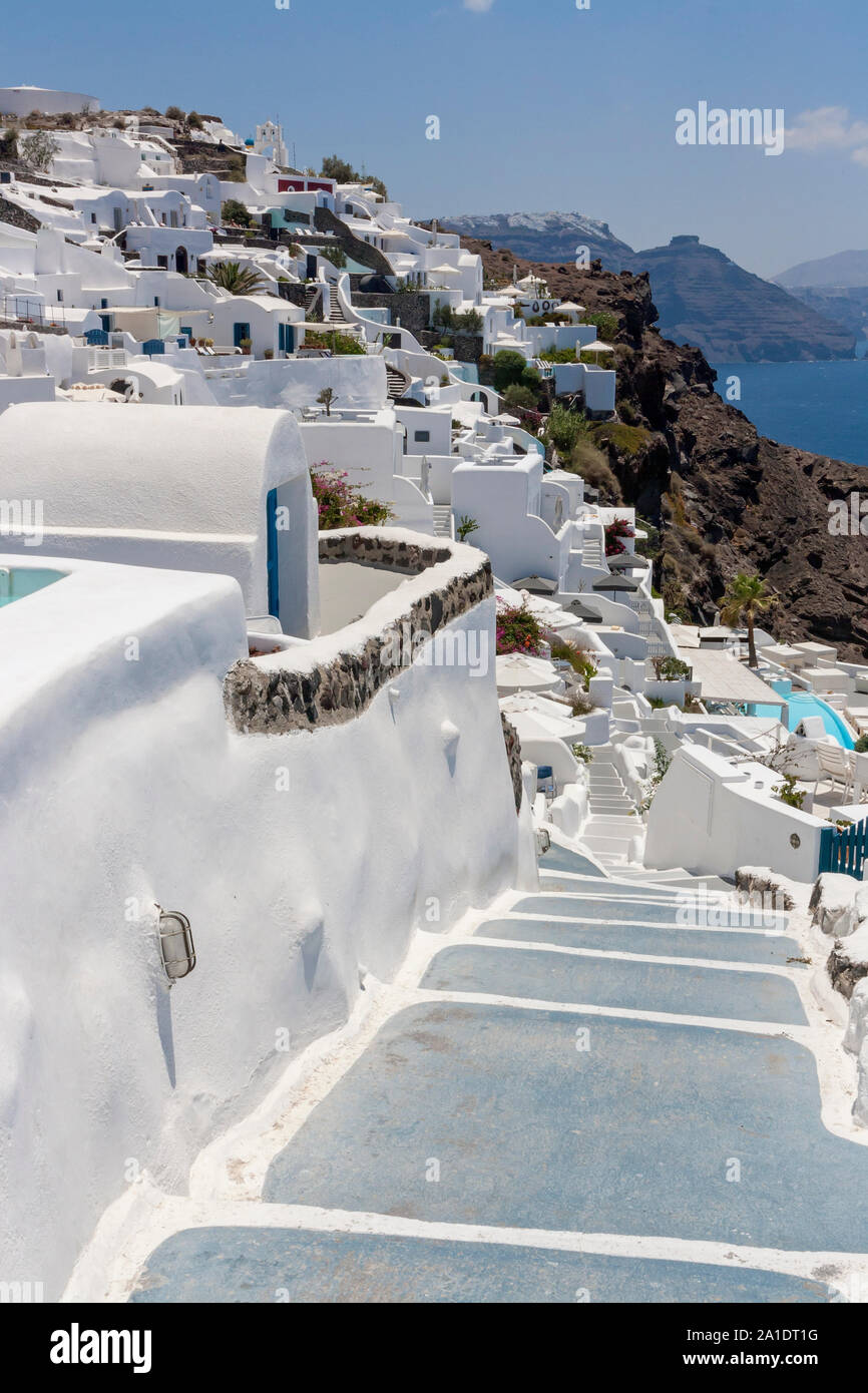 A white path in Oia's village on Santorini's island, Greece Stock Photo ...
