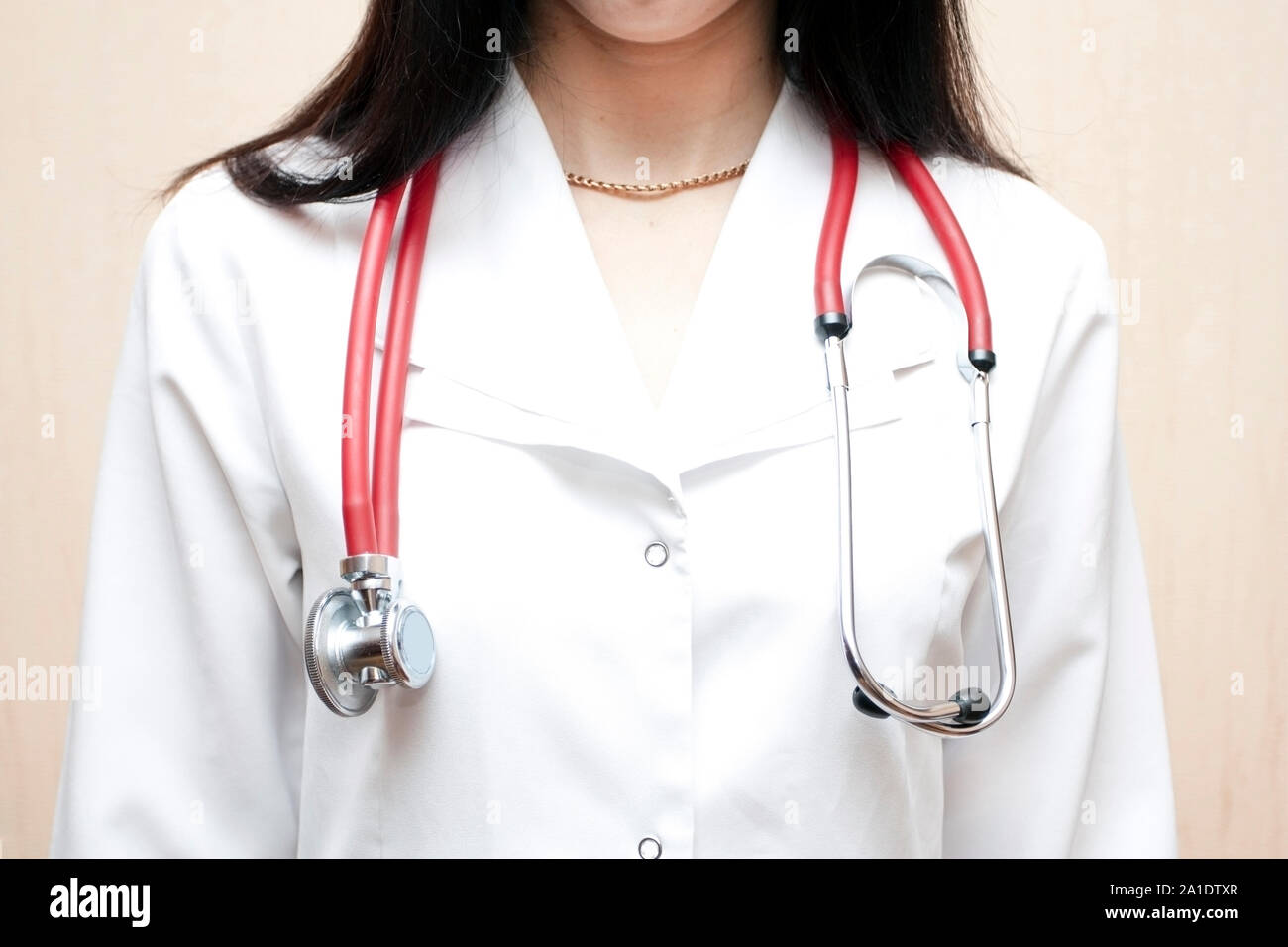 The doctor in a white dressing gown with a stethoscope Stock Photo - Alamy