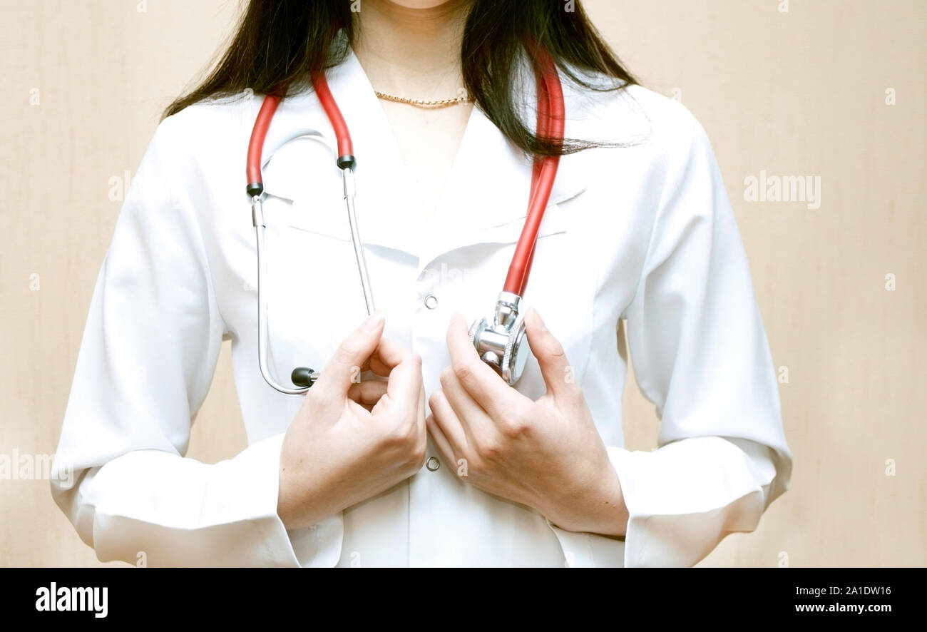 The doctor in a white dressing gown with a stethoscope Stock Photo - Alamy