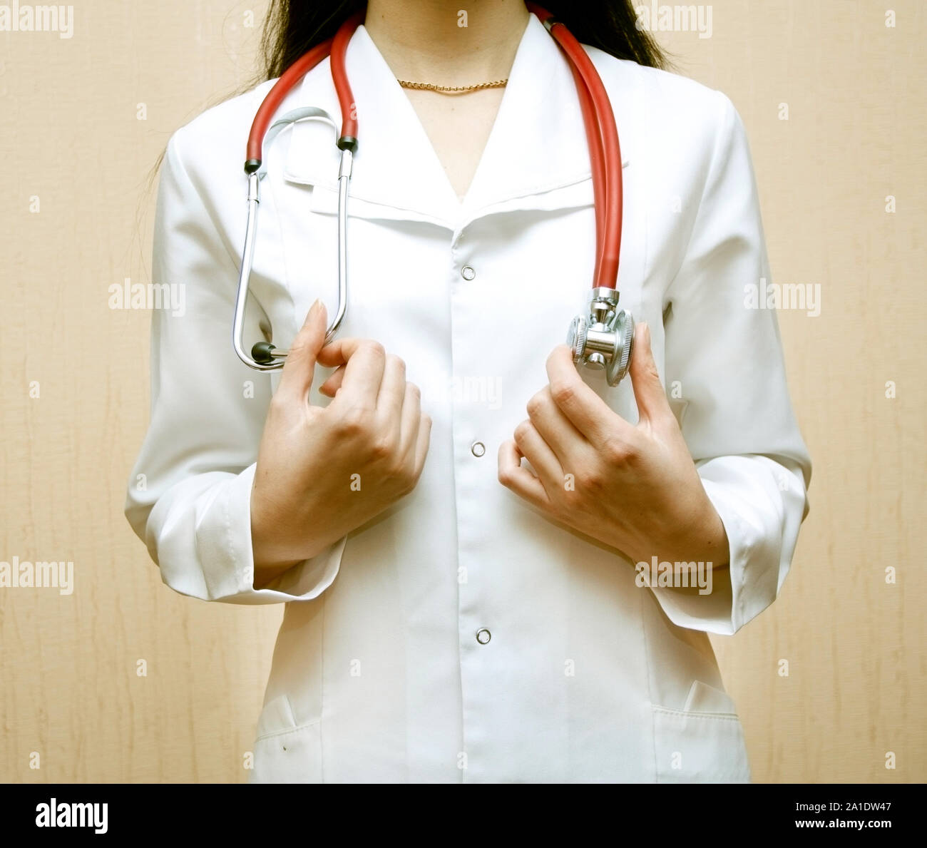 The doctor in a white dressing gown with a stethoscope Stock Photo - Alamy