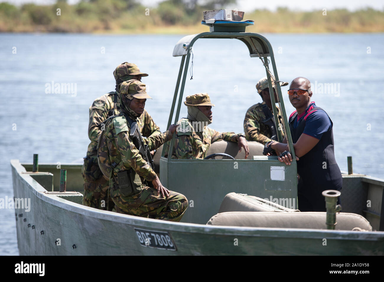 A Botswana Defence Force anti-poaching patrol, on the Chobe river in ...