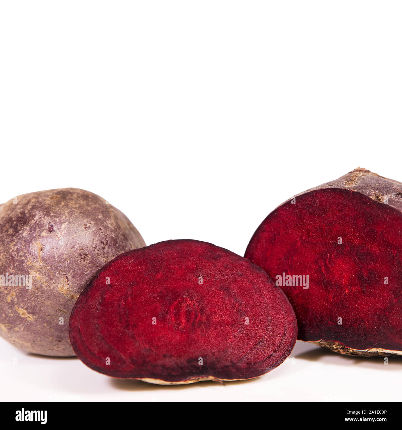 fresh beetroot, unpeeled and sliced in front of white background Stock ...