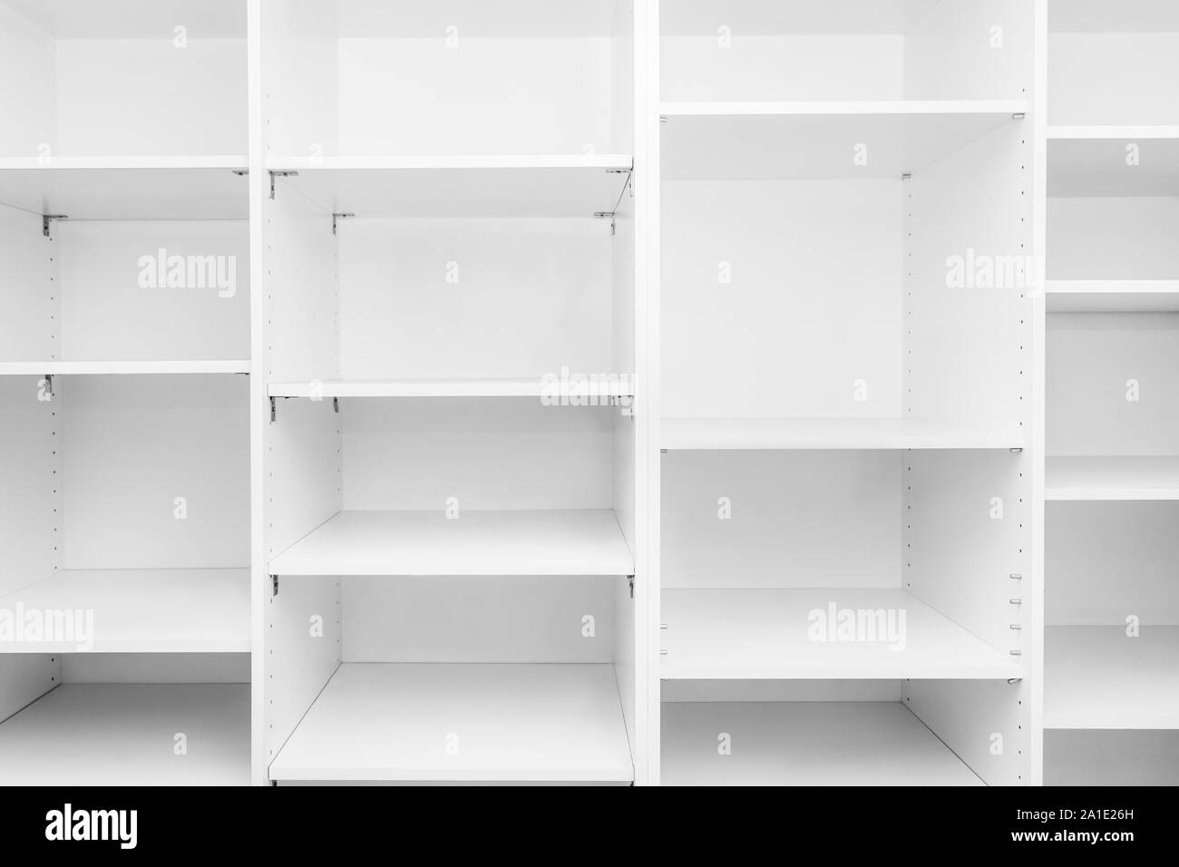 horizontal background with various empty white shelves Stock Photo - Alamy