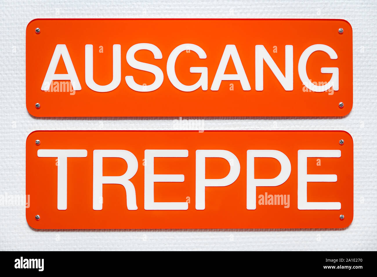 red signs with german words ausgang and treppe which means exit and ...
