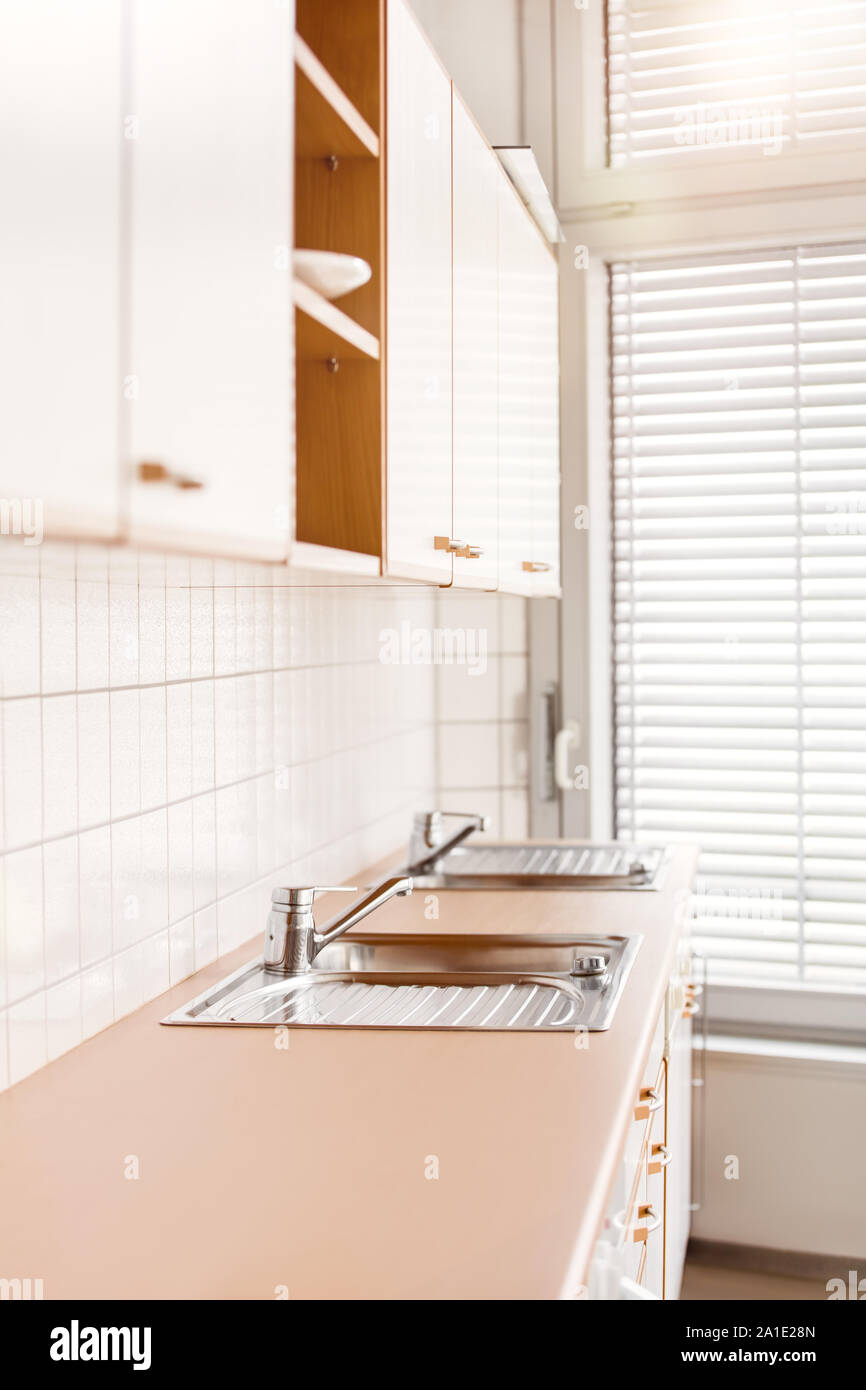 empty modern kitchen with glass front and backlight Stock Photo - Alamy