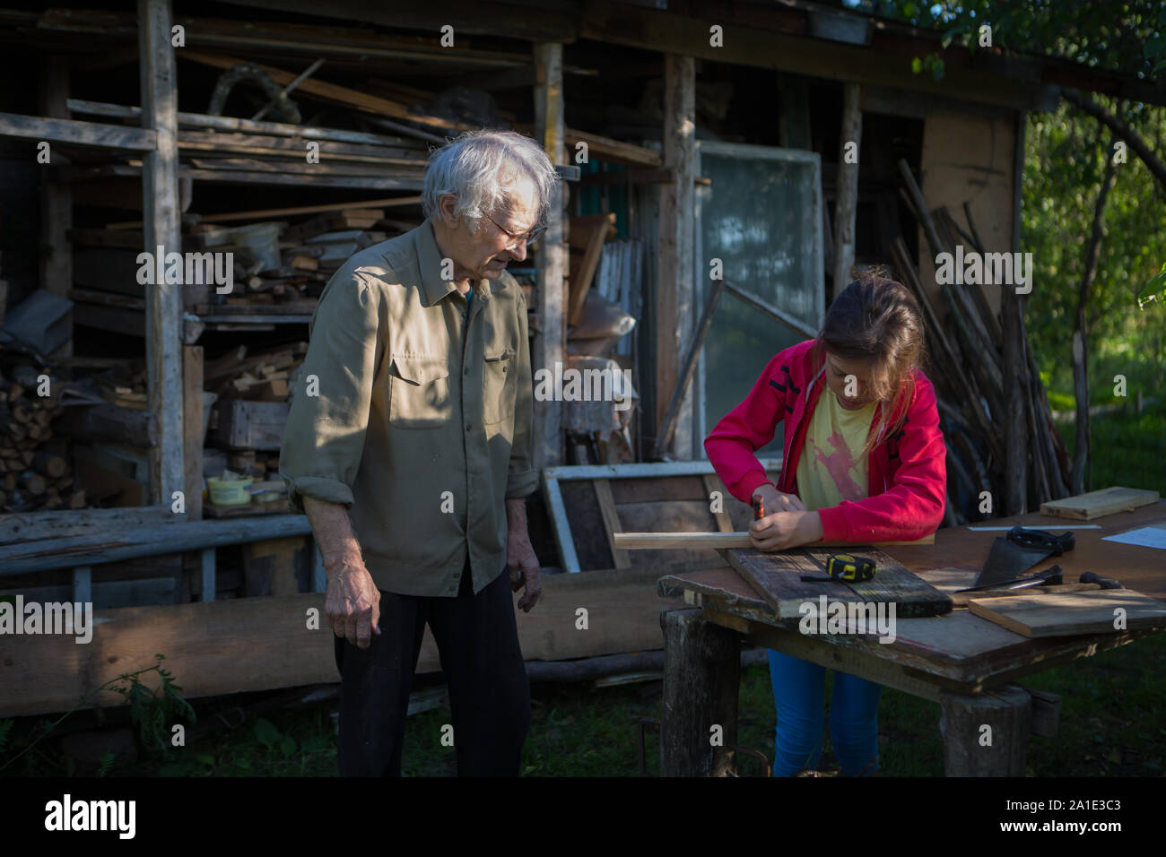 Child makes drawing pencil house hi-res stock photography and images ...