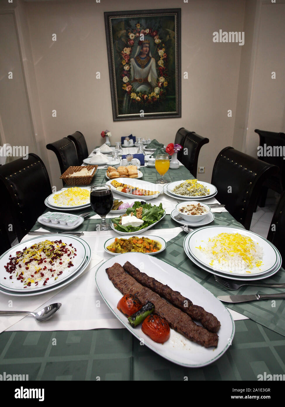 Iranian kebabs and rice with appetizer foods on the restaurant table ...