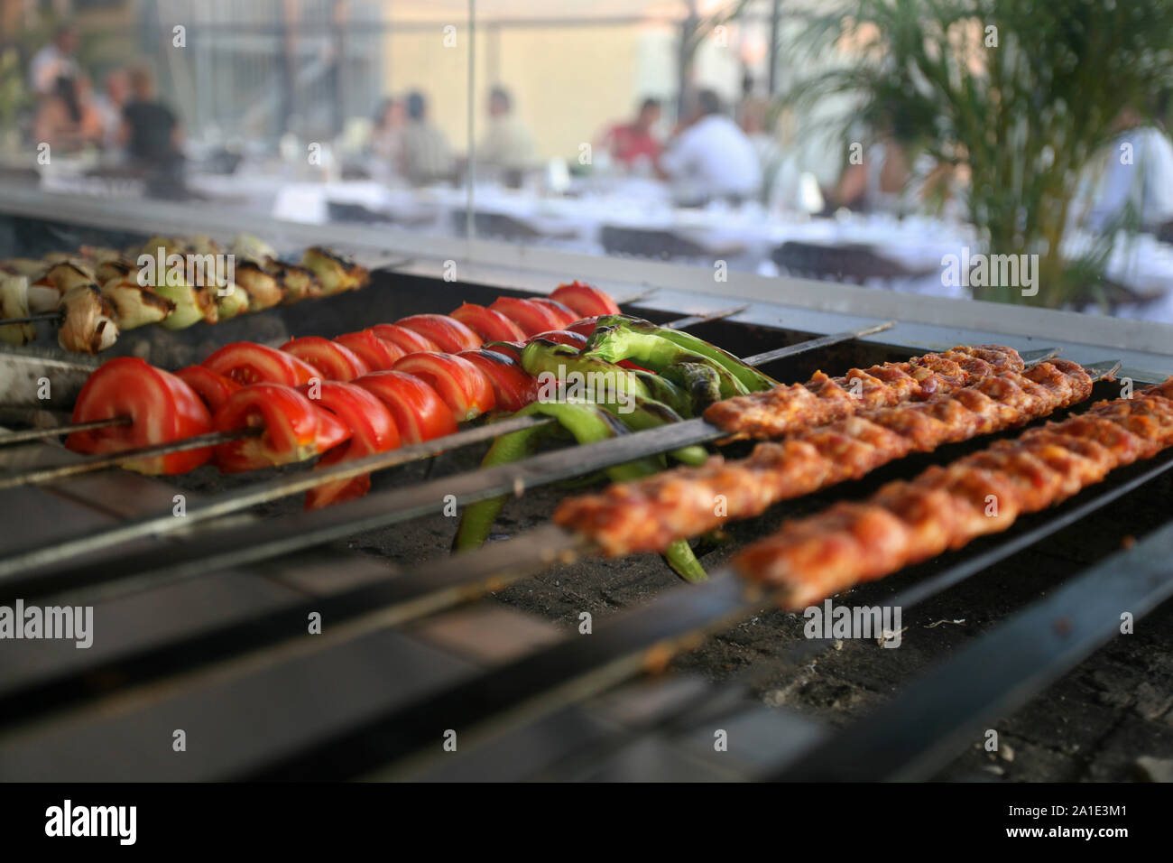 Turkish Kebabs (Adana Kebab) on the barbecue grill at the restaurant ...