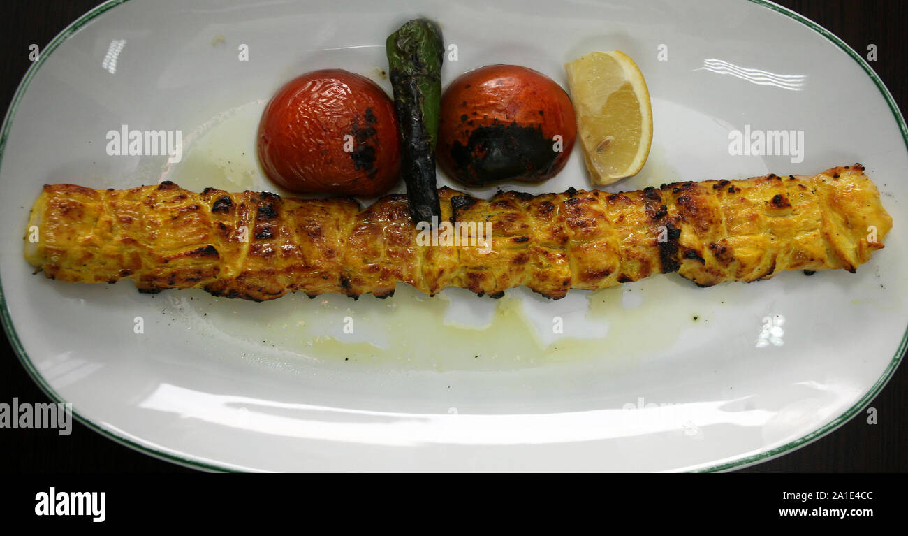 Traditional chicken kebab on the dinner plate Stock Photo - Alamy