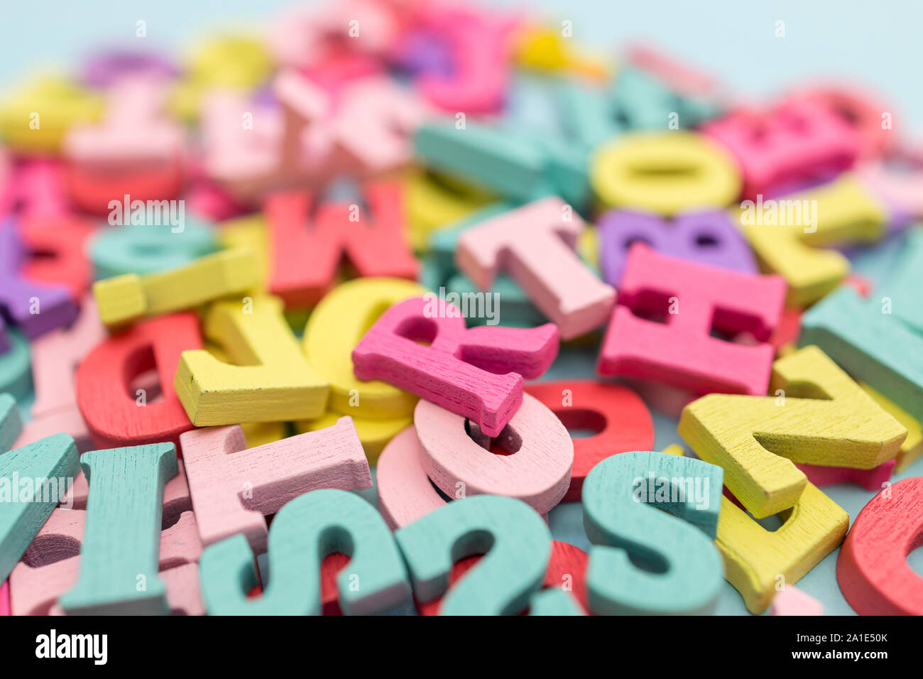 Alphabet wooden letters abstract on color background Stock Photo - Alamy