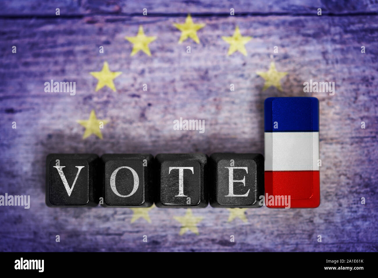 word vote on pieces on buttons with a french flag. wooden background ...