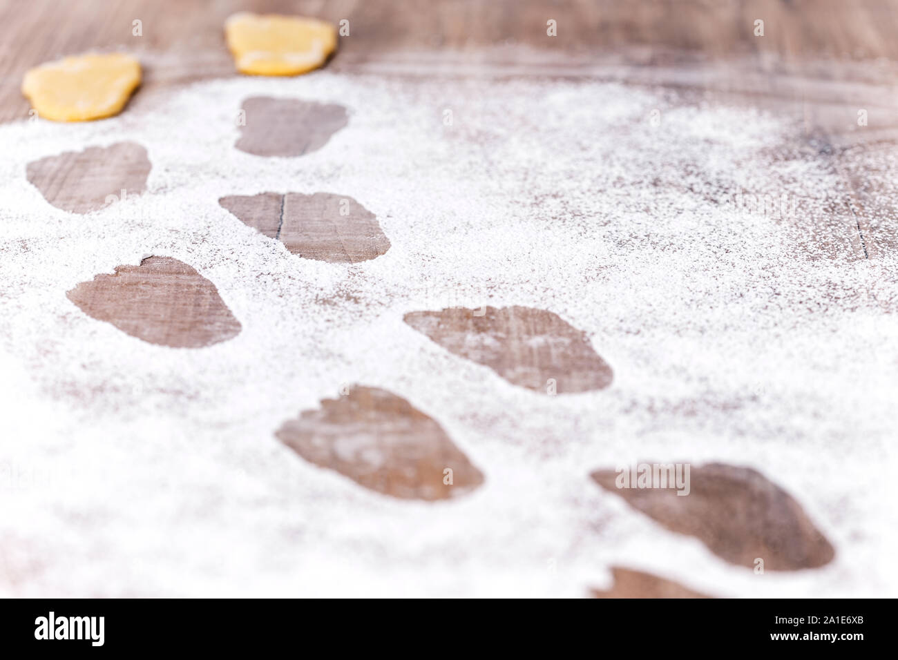 Footprints or footsteps on icing sugar, concept baby birth and bakery ...