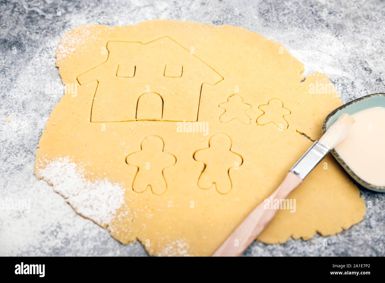 Family and house shape cutout from raw cookie dough, concept homestead ...
