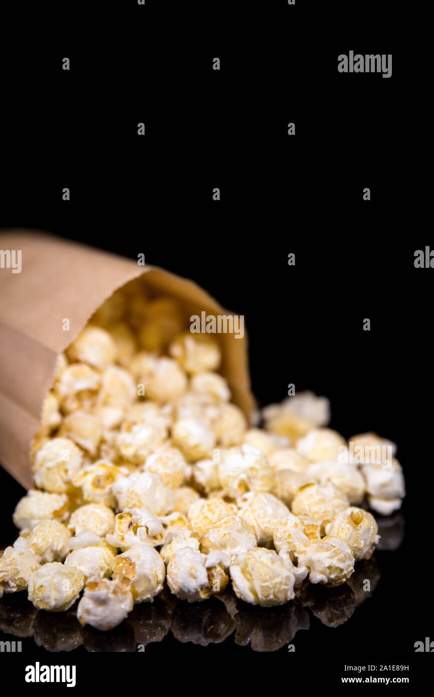 Popcorn box in front of black background, concept Party and funfair ...