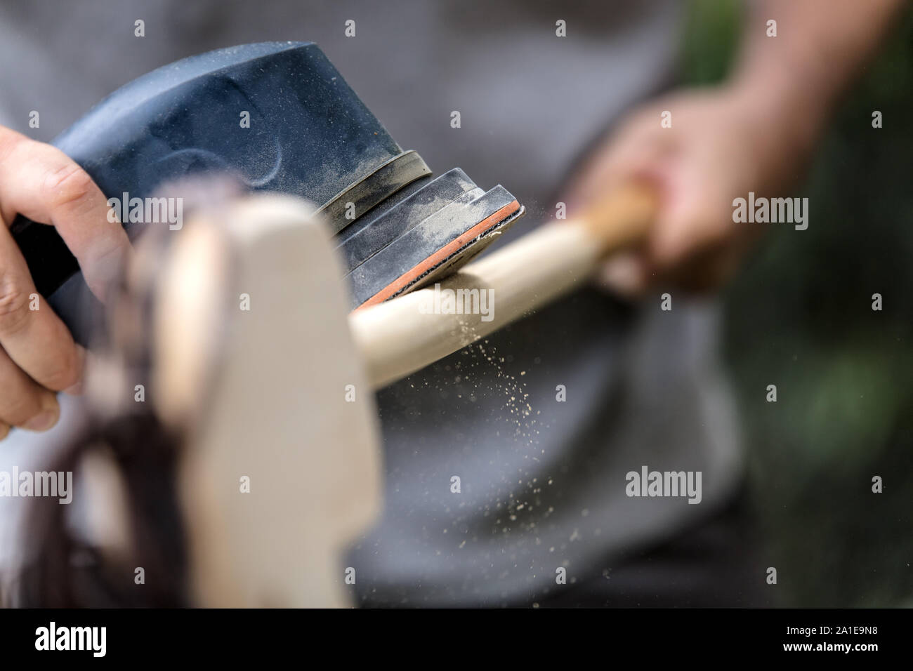 man is sanding an hobbyhorse with an electric sander Stock Photo - Alamy
