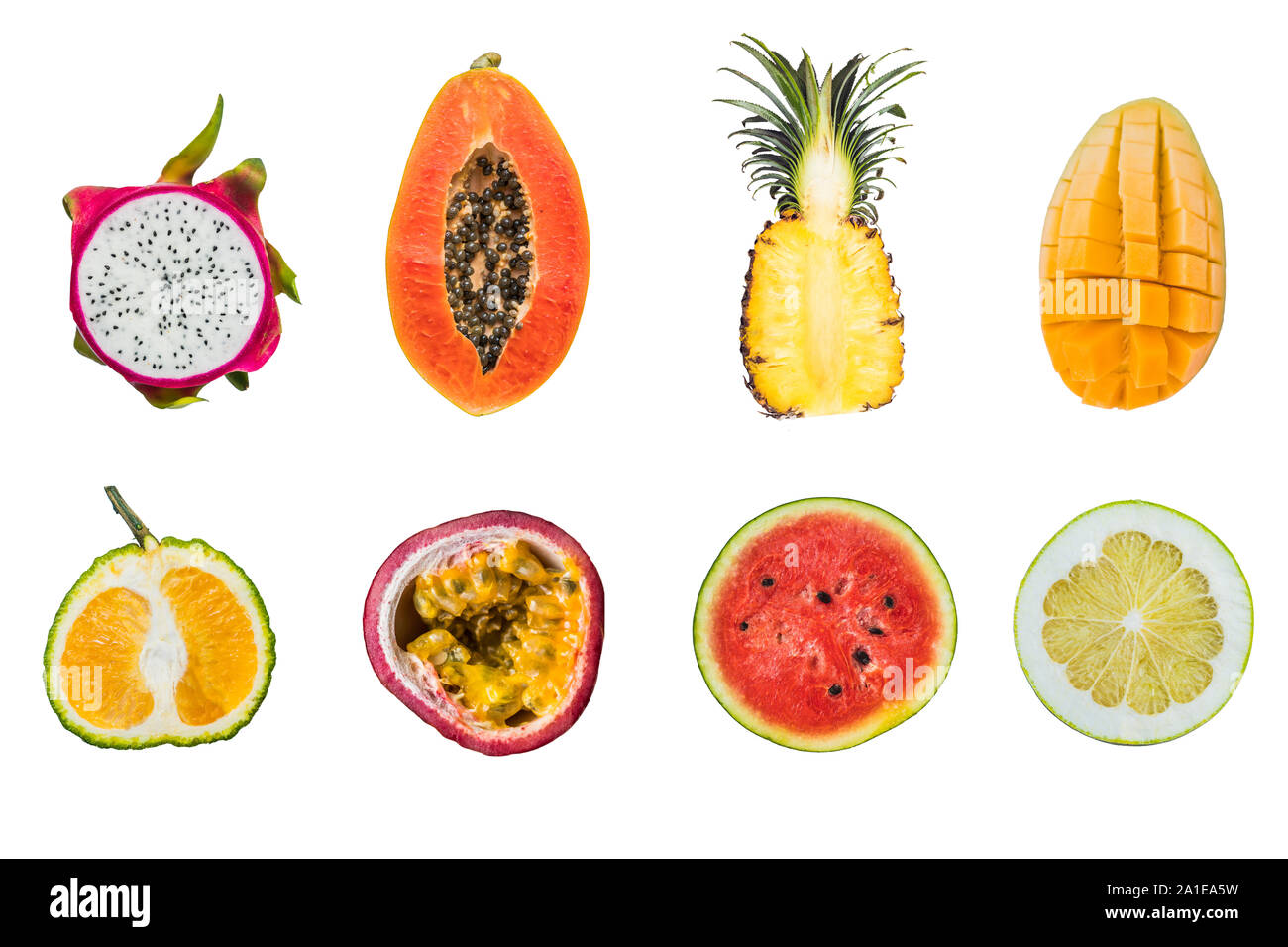 A lot of different tropical fruits cut halves isolated on white Stock ...