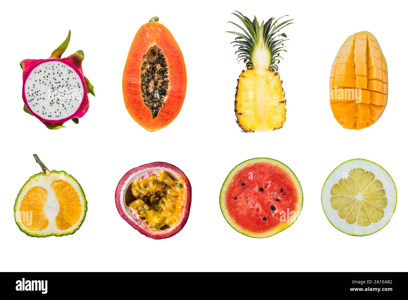 A lot of different tropical fruits cut halves isolated on white Stock ...