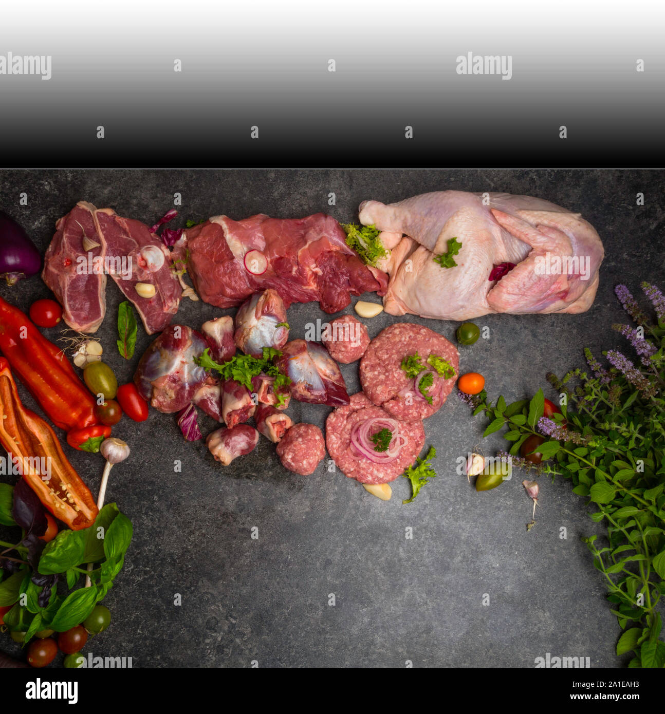 Assorted raw meat on dark background. Different types of meat and ...