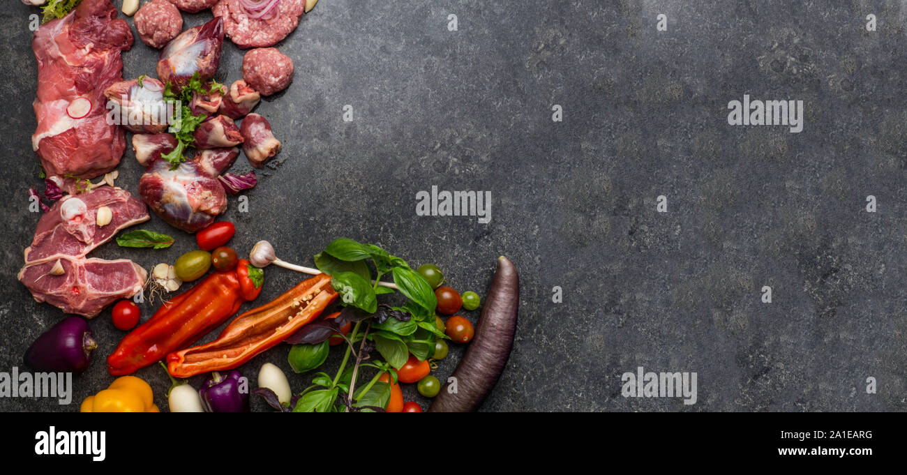 Assorted raw meat on dark background. Different types of meat and ...