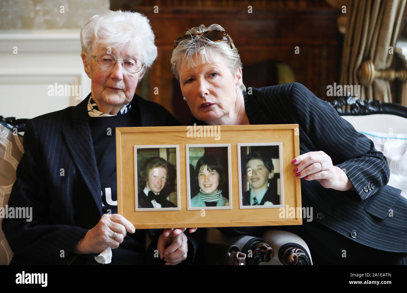 Bridget McDermott and her daughter June hold pictures of their ...