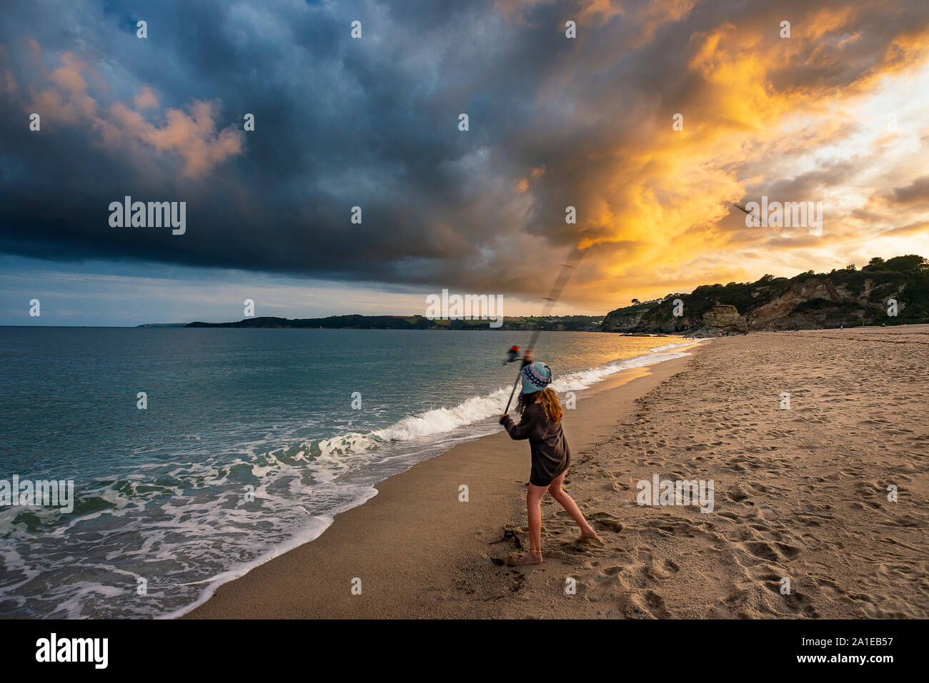 Woman fishing off beach hi-res stock photography and images - Alamy