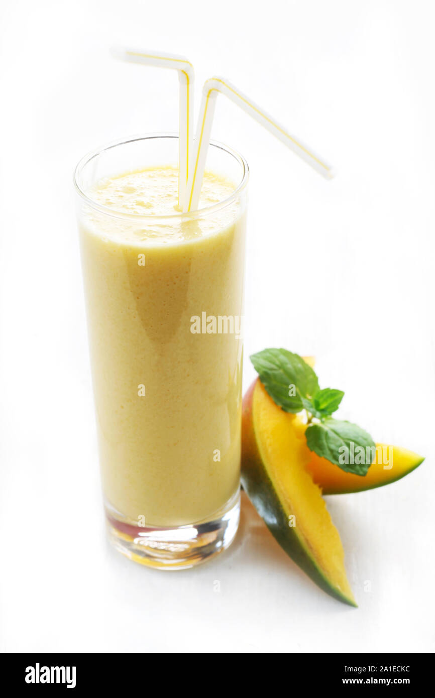 A Glass Of Mango Milkshake Isolated On White Stock Photo - Alamy
