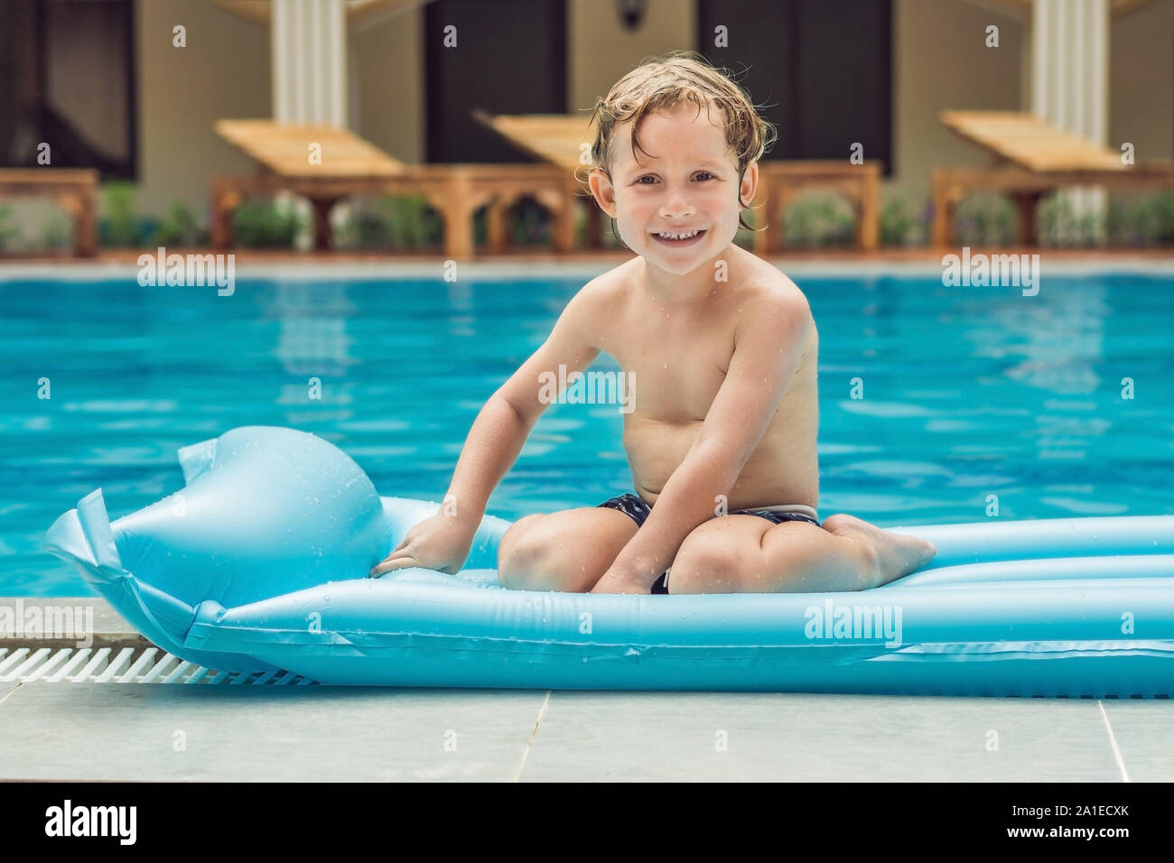 Boy lying on inflatable mattress hi-res stock photography and images ...