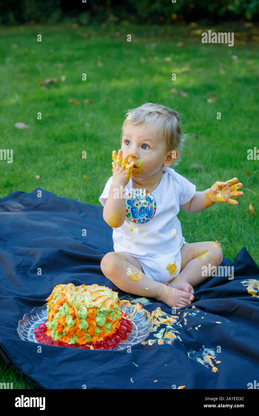 Child eating messy cake hi-res stock photography and images - Alamy