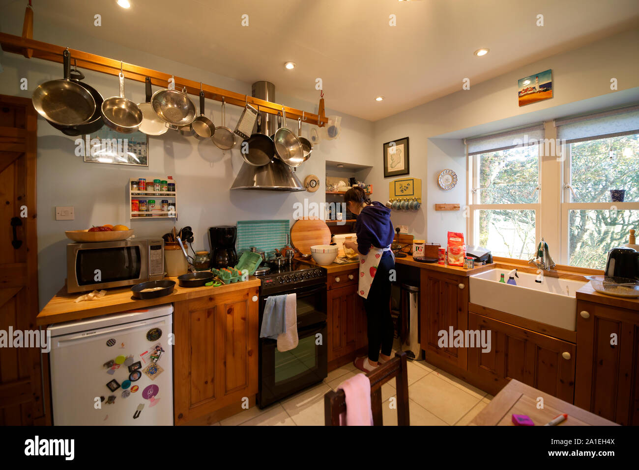 Teenage girl baking in kitchen Stock Photo - Alamy