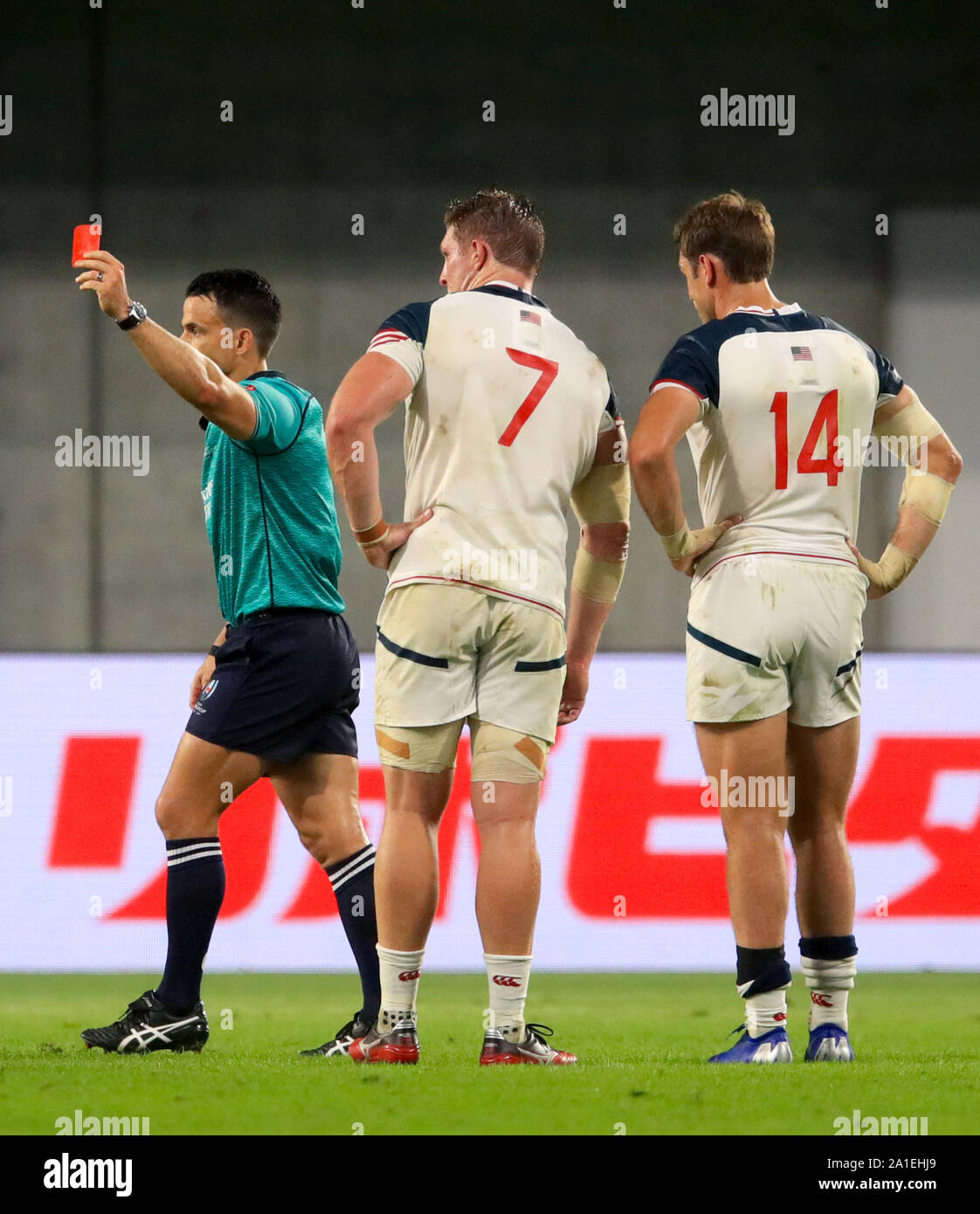 Referee Nic Berry shows USA's John Quill (centre) the card during the ...