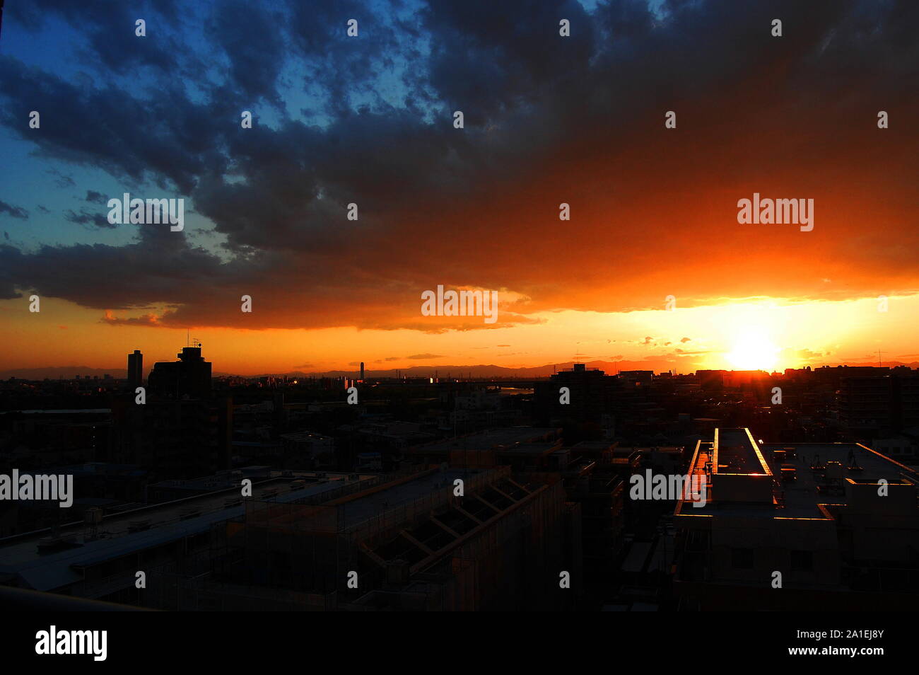 Sunset and clouds before a storm with red sky in Japan Stock Photo - Alamy