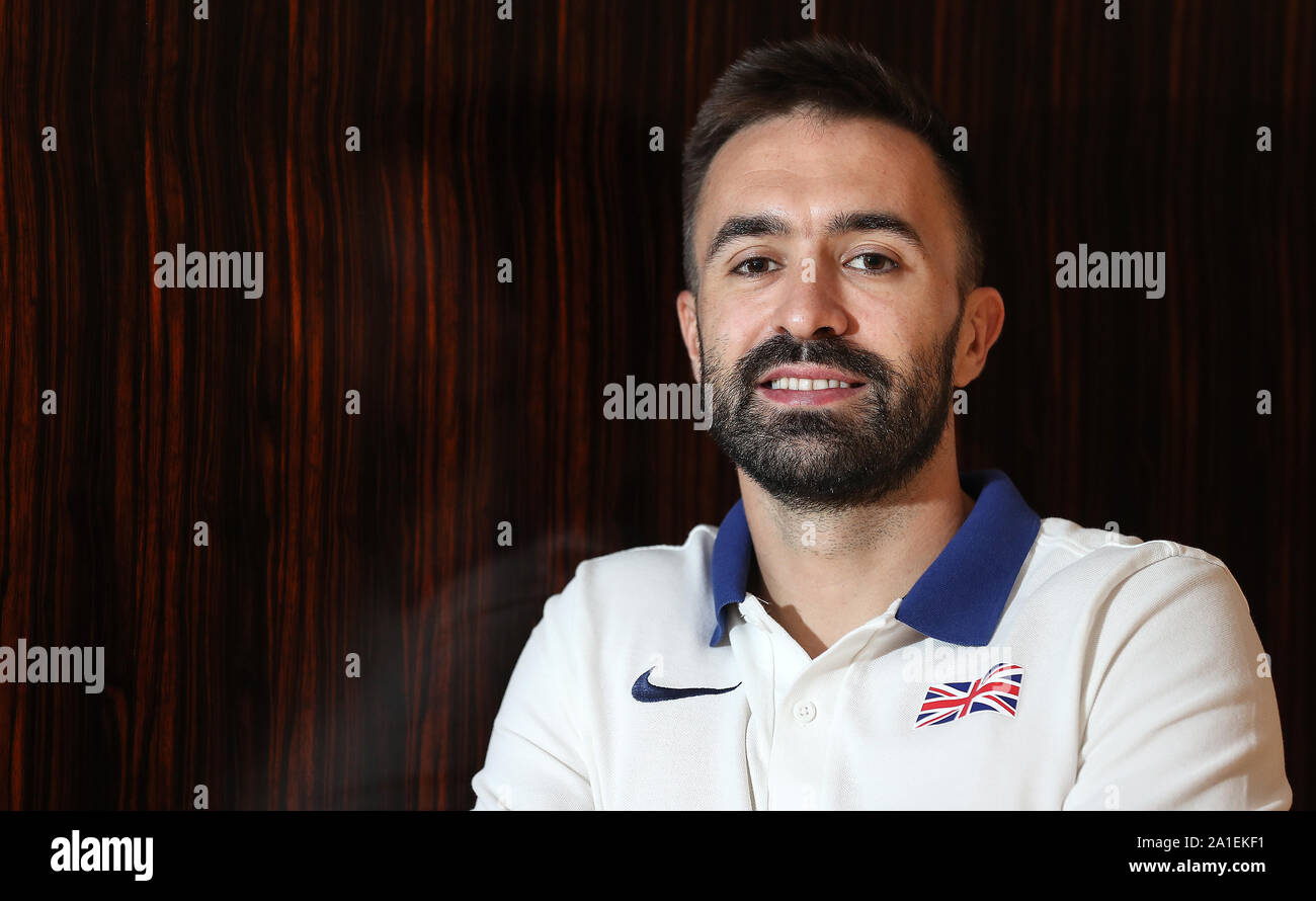 Great Britain's Martyn Rooney poses for photographs during a media ...
