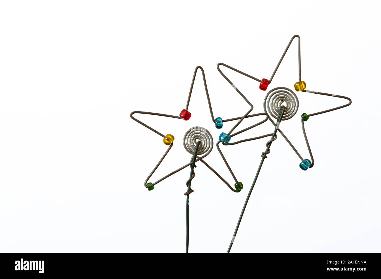 Two iconic but simple Christmas stars created out of wire and beads ...