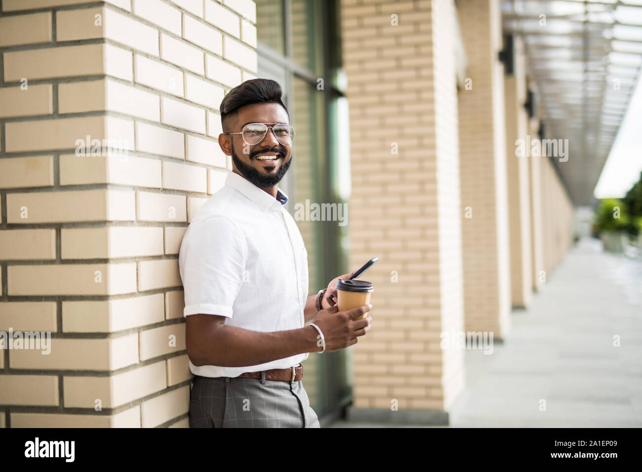 Young indian guy serious look hi-res stock photography and images - Alamy