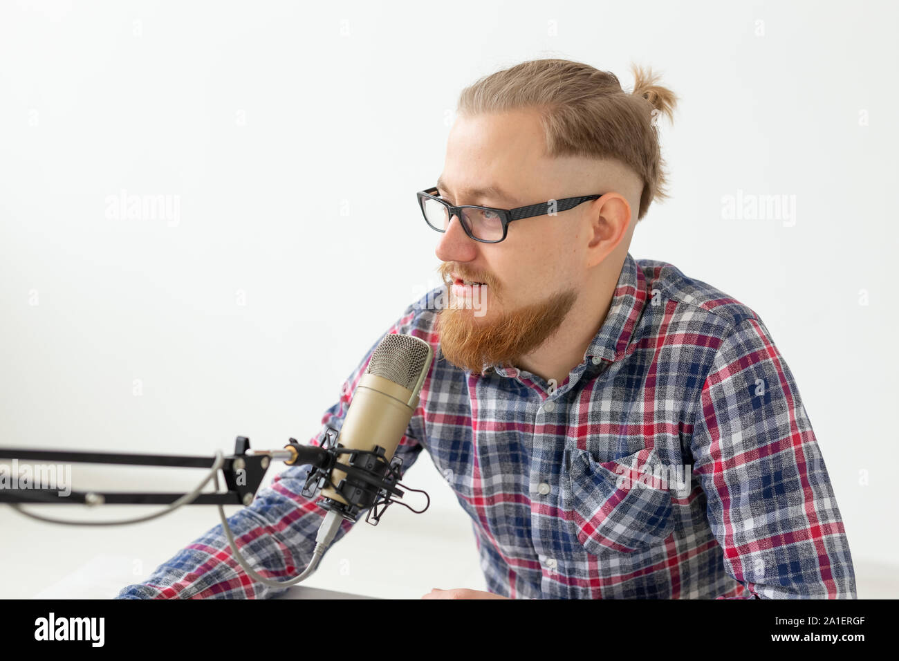 Radio host concept - Side view of handsome man working as radio host at ...