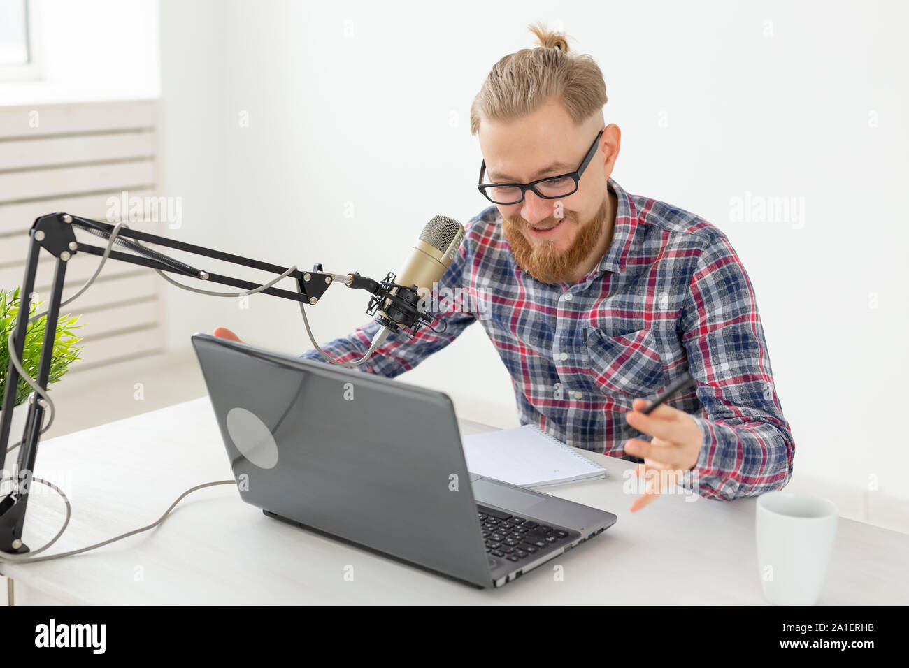 Radio host concept - Handsome man working as radio host at radio ...