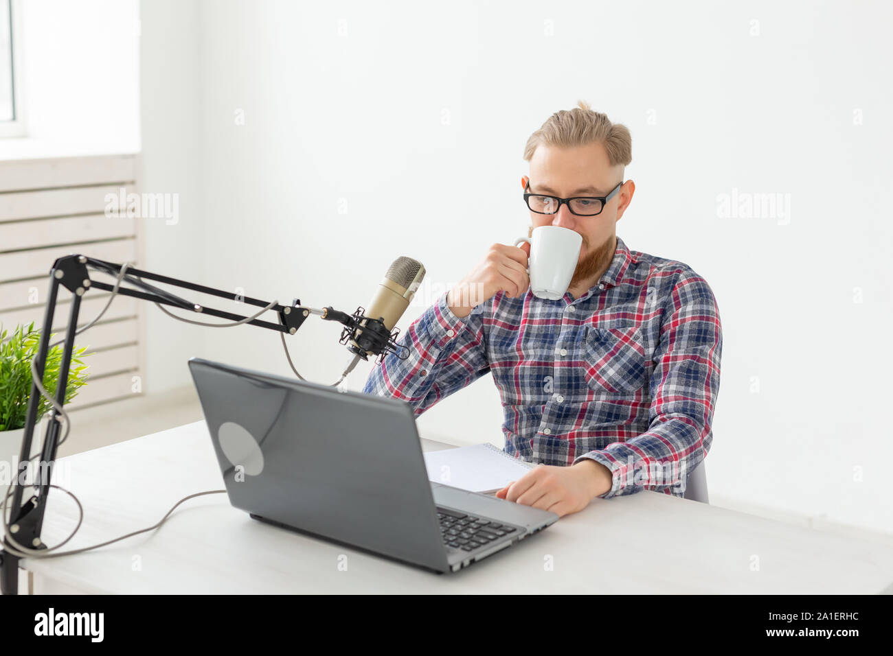 Radio host concept - Side view of handsome man working as radio host at ...