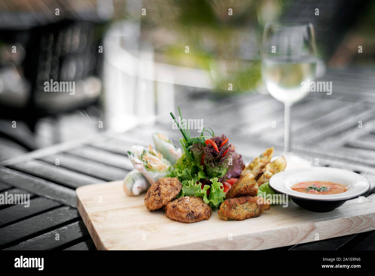 mixed asian seafood snacks tapas platter on bangkok restaurant table ...