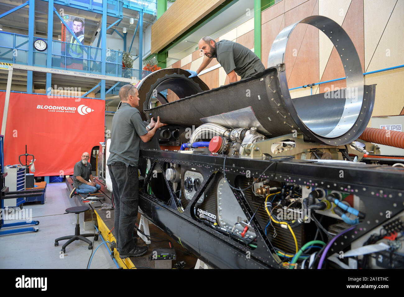 Engineers mount an air intake for the Rolls Royce Typhoon jet engine ...