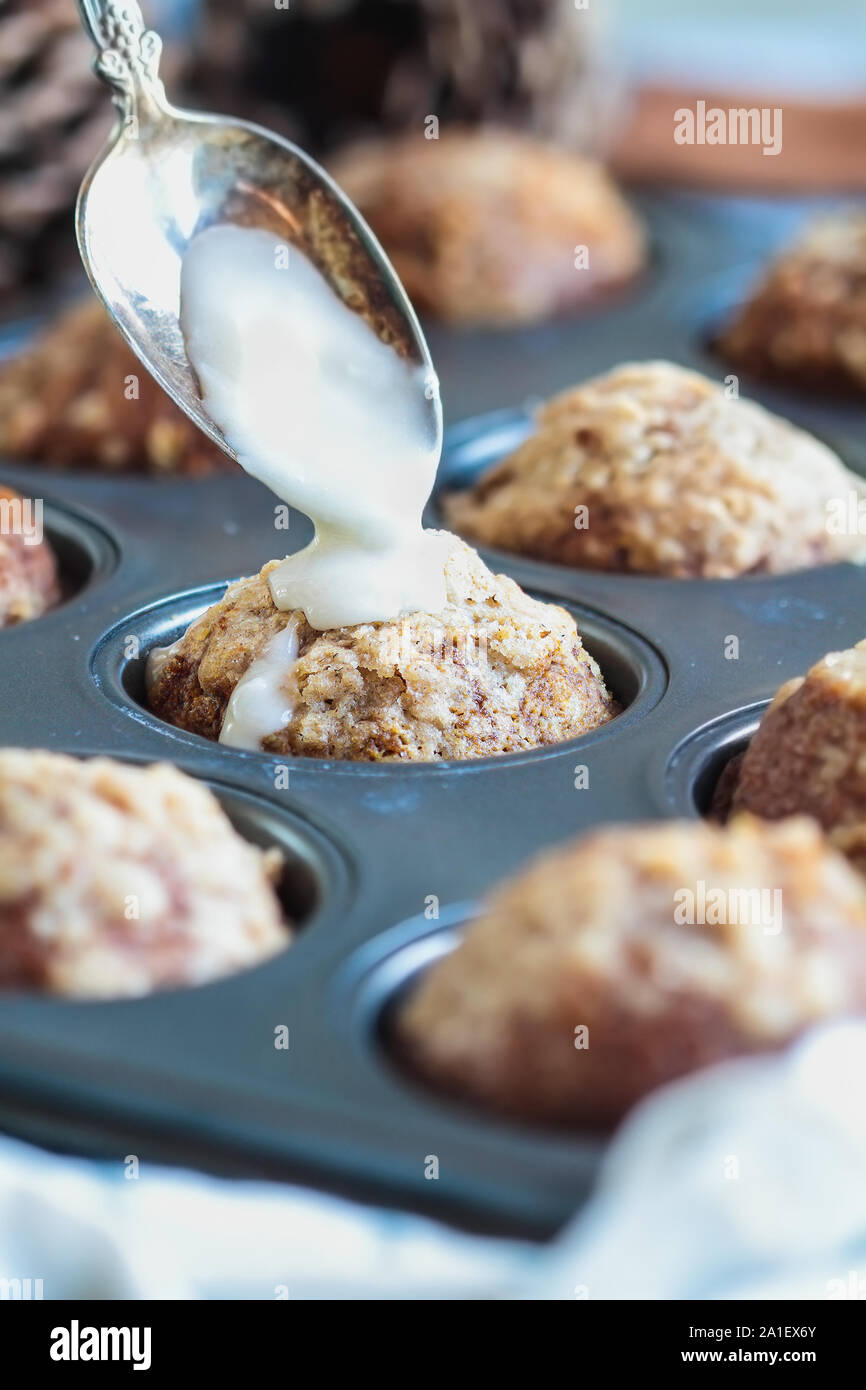 Fresh from the oven, homemade pumpkin muffins with streusel with spoon ...