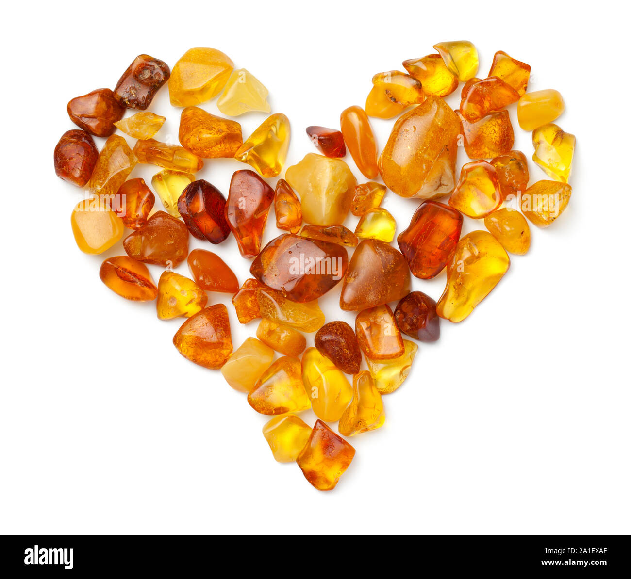 Heart made of ambers isolated on white background. Polished ambers. Top ...
