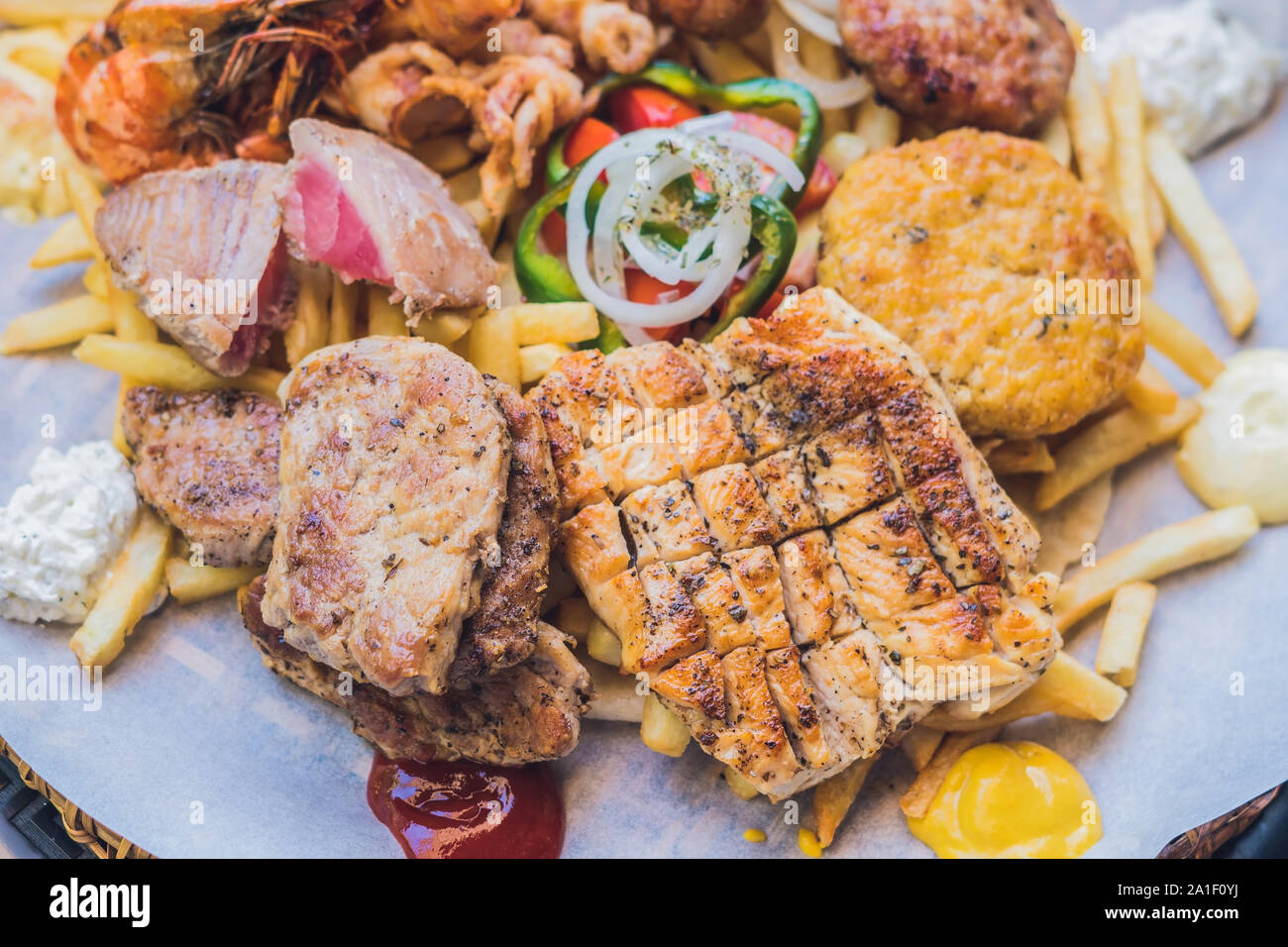 Big set Greek food Meat plate with potatoes and sauce Stock Photo - Alamy
