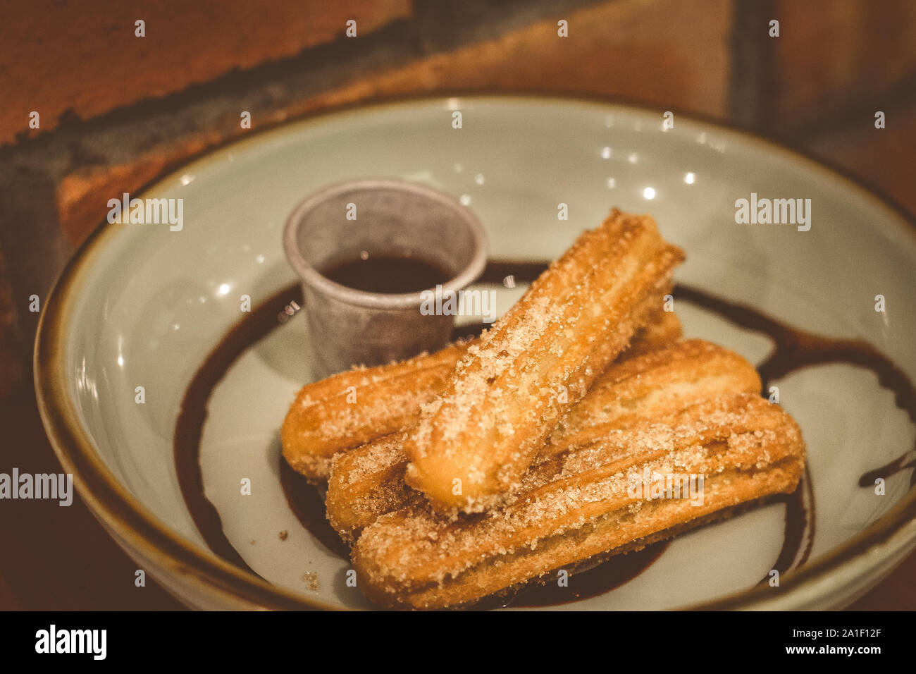 Churros Fried Spanish donuts (x4) stacked and served with chocolate dip ...
