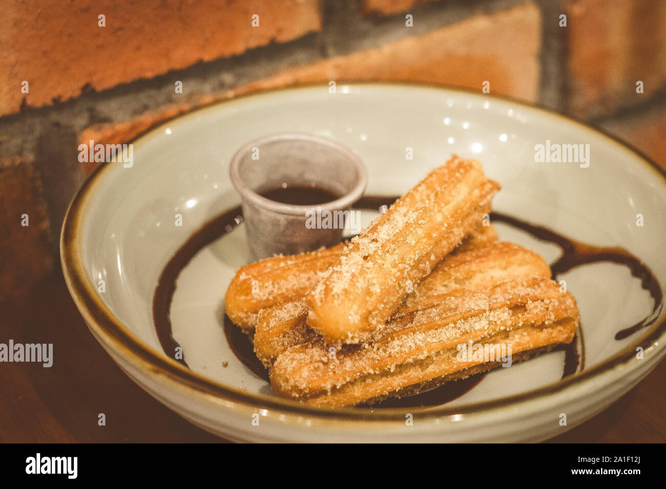 Churros Fried Spanish donuts (x4) stacked and served with chocolate dip ...